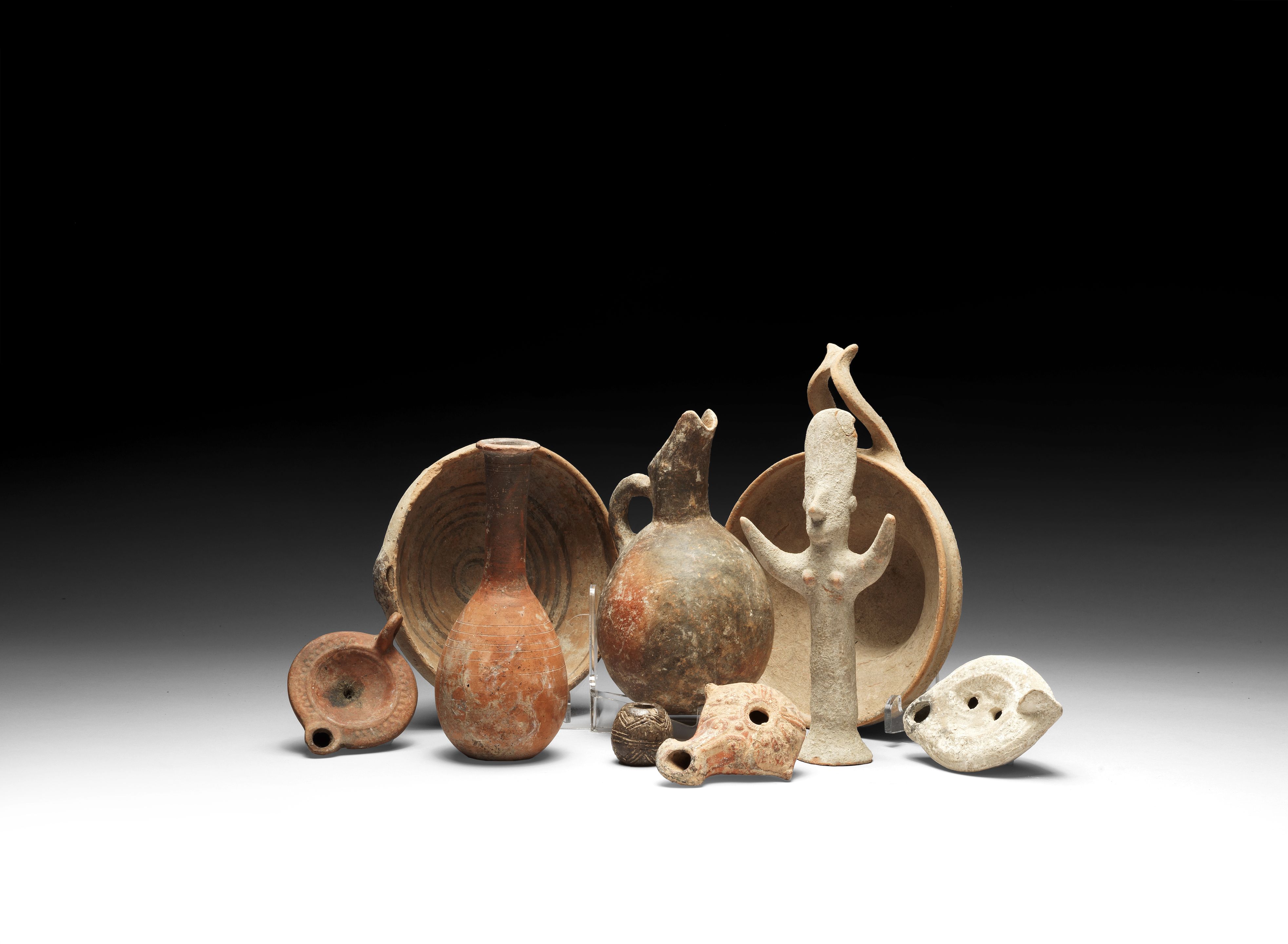 Bonhams : Five Cypriot terracotta objects and four Roman terracotta ...