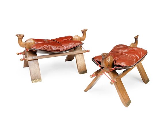 Bonhams : A pair of Pakistani early 20th century brass inlaid camel ...