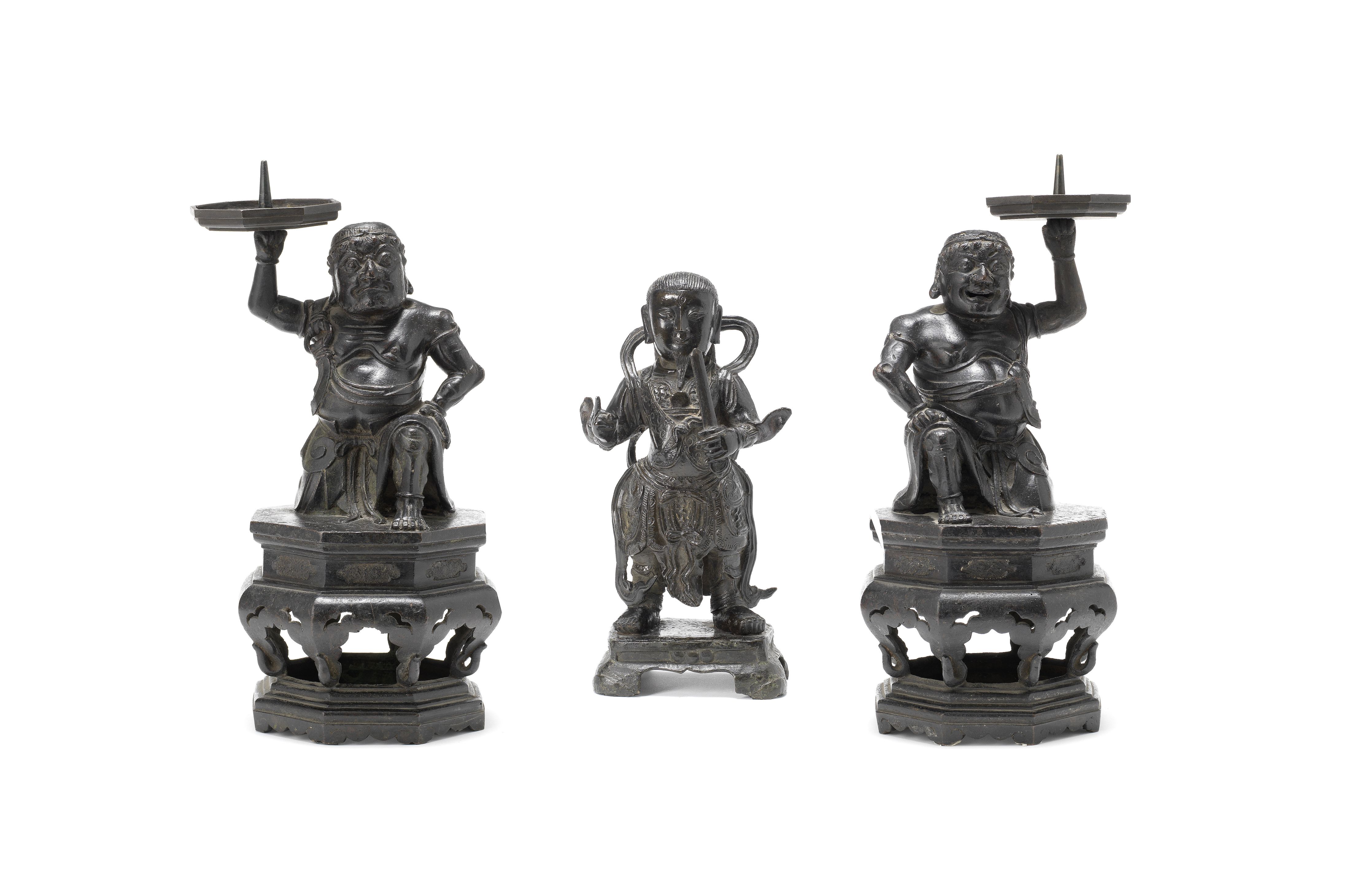 Bonhams : A pair of bronze figural candlesticks and a bronze figure of ...