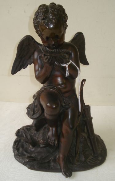 Bonhams : A patinated bronze of Cupid, seated drinking from a scallop ...