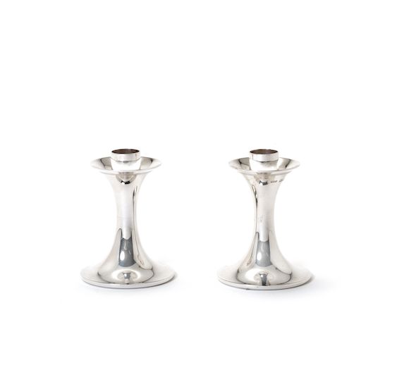 Bonhams : GERALD BENNEY: A pair of silver dwarf candlesticks London ...