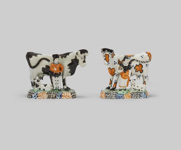 Bonhams : A pair of Yorkshire Pratt Ware cow groups, circa 1820-25