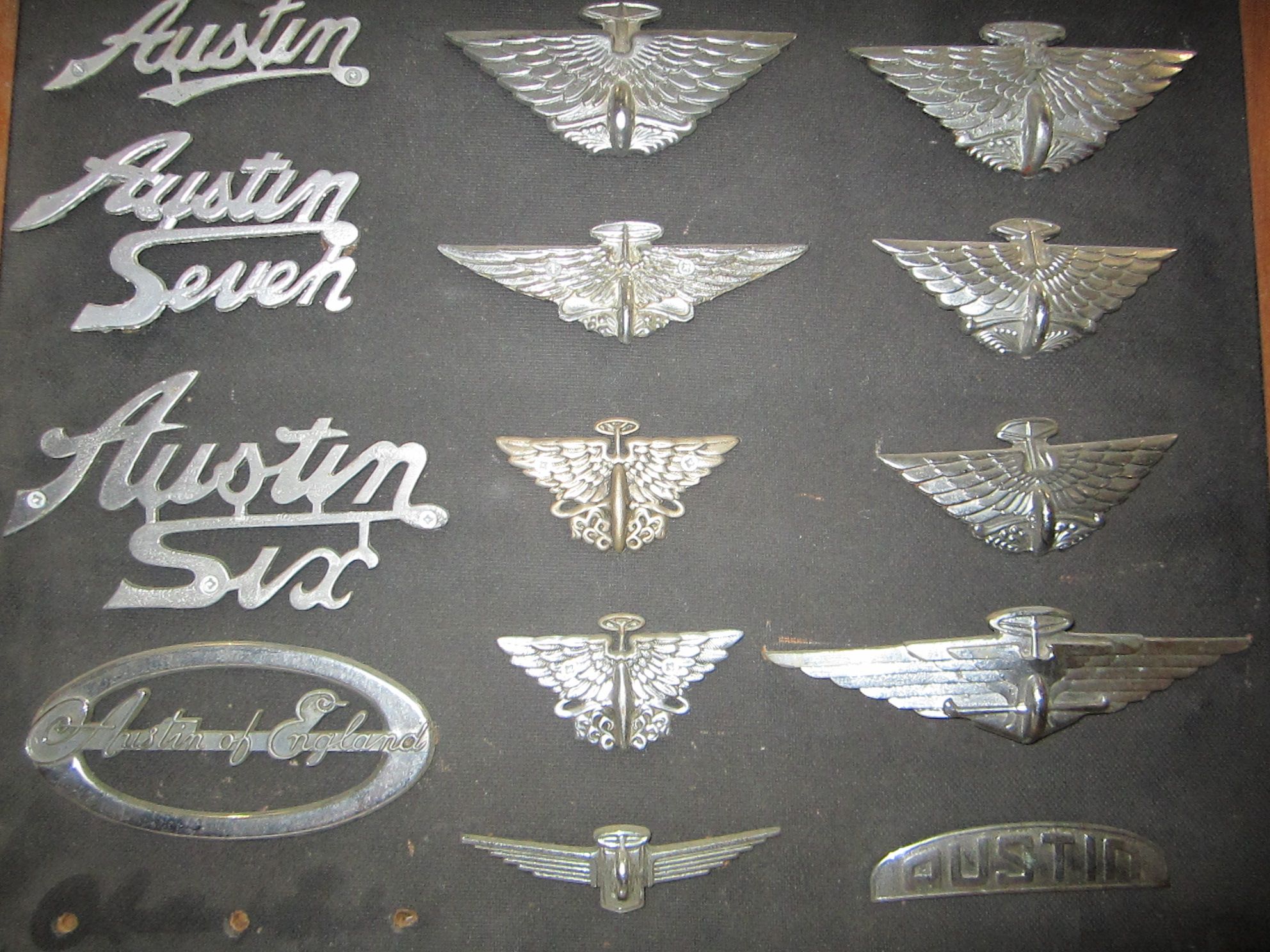 Bonhams Cars : A collection of Austin scripts and radiator badges,