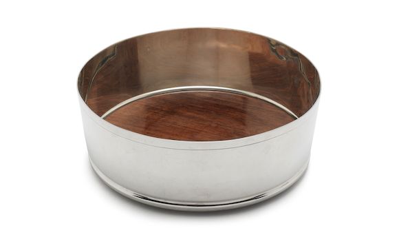 Bonhams : GERALD BENNEY A silver bottle / decanter coaster London 1985