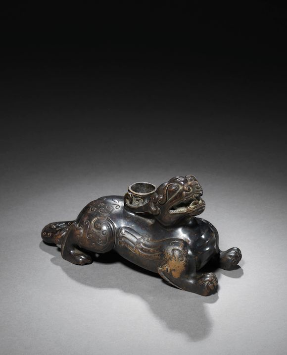 Bonhams : A fine bronze 'chimera' recumbent water dropper Qianlong