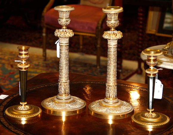 Bonhams : Two pairs of French Empire style gilt and parcel gilt brass ...