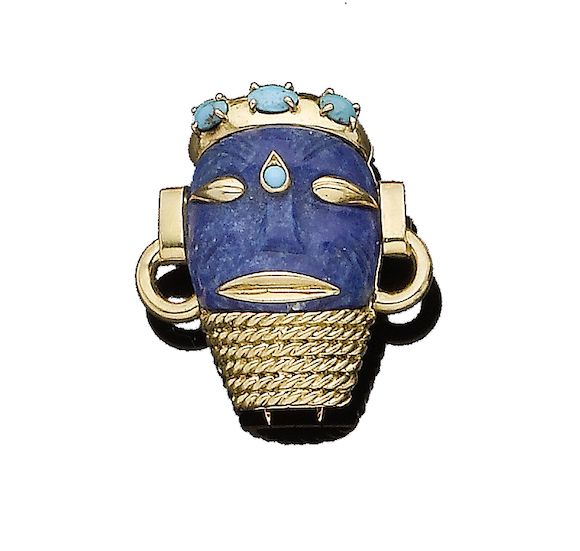 Bonhams : A lapis lazuli and turquoise tribal mask brooch, by Cartier,