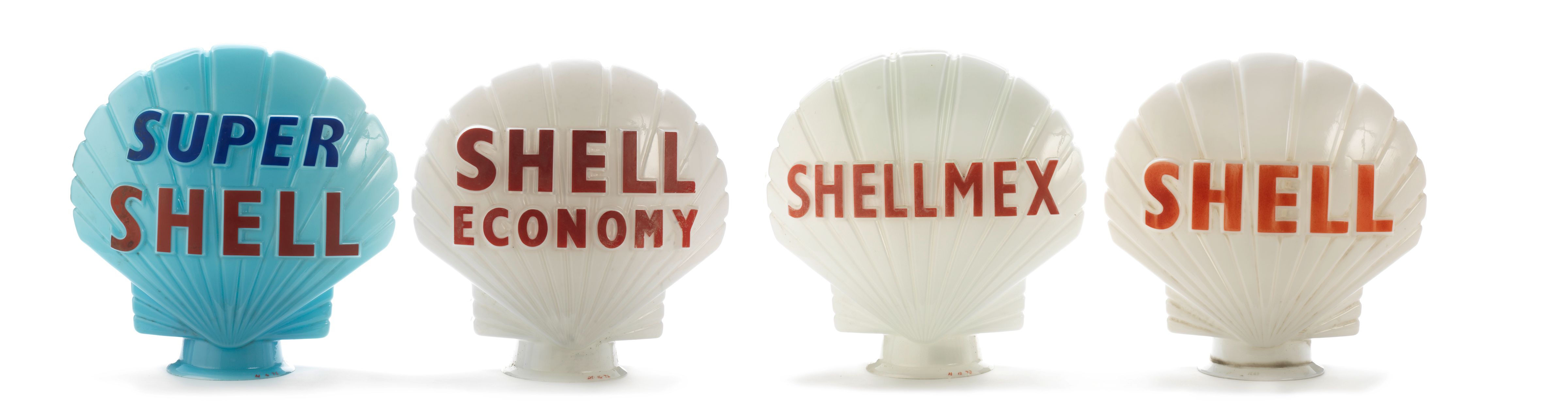 Bonhams Cars : A set of four Shell glass petrol pump globes,