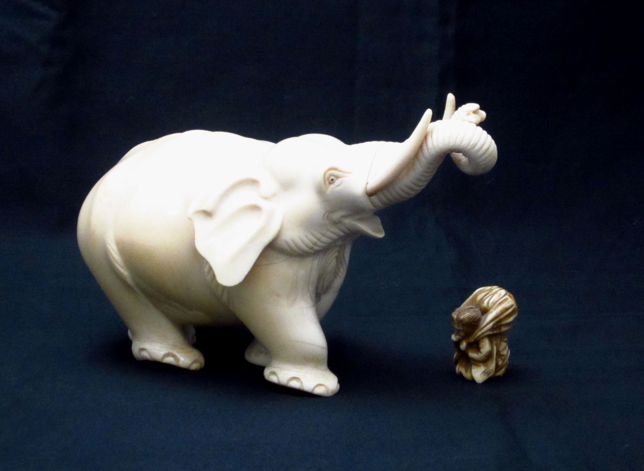 Bonhams : A carved ivory model of an elephant and a netsuke Meiji