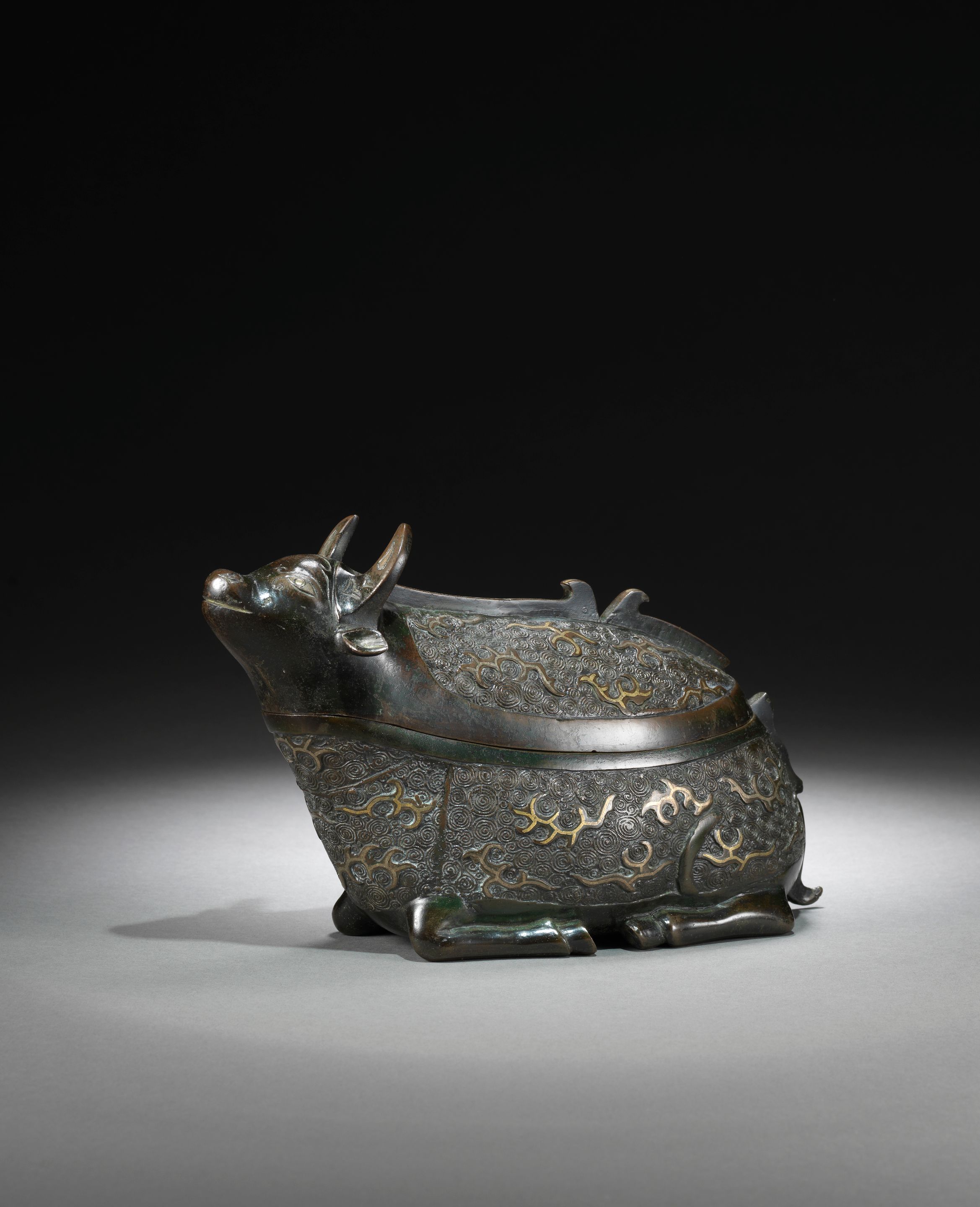 Bonhams : An archaistic silver-inlaid bronze 'recumbent ox' libation ...