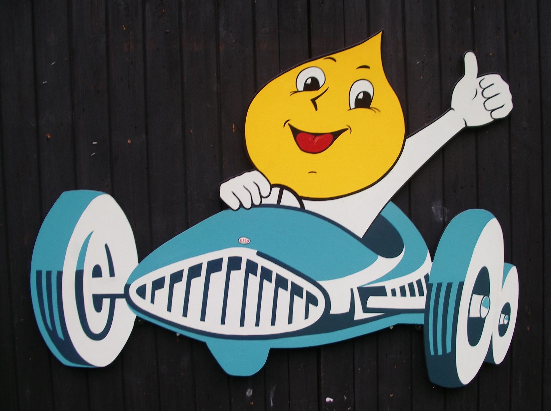 Bonhams Cars : A hand-painted 'Esso Man Race Driver' cut-out display panel,