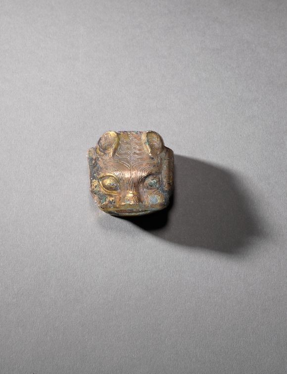 Bonhams : An archaic gilt-bronze 'tiger' pole fitting Eastern Zhou dynasty