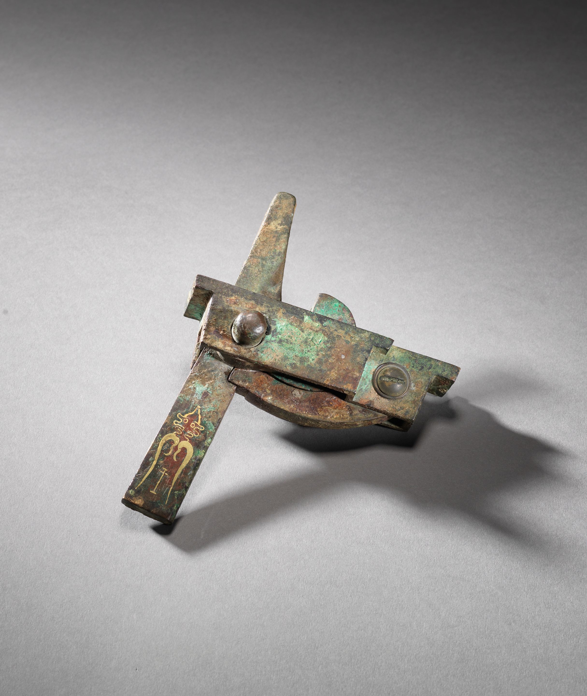Bonhams : An archaic bronze and gold-inlaid crossbow trigger mechanism ...