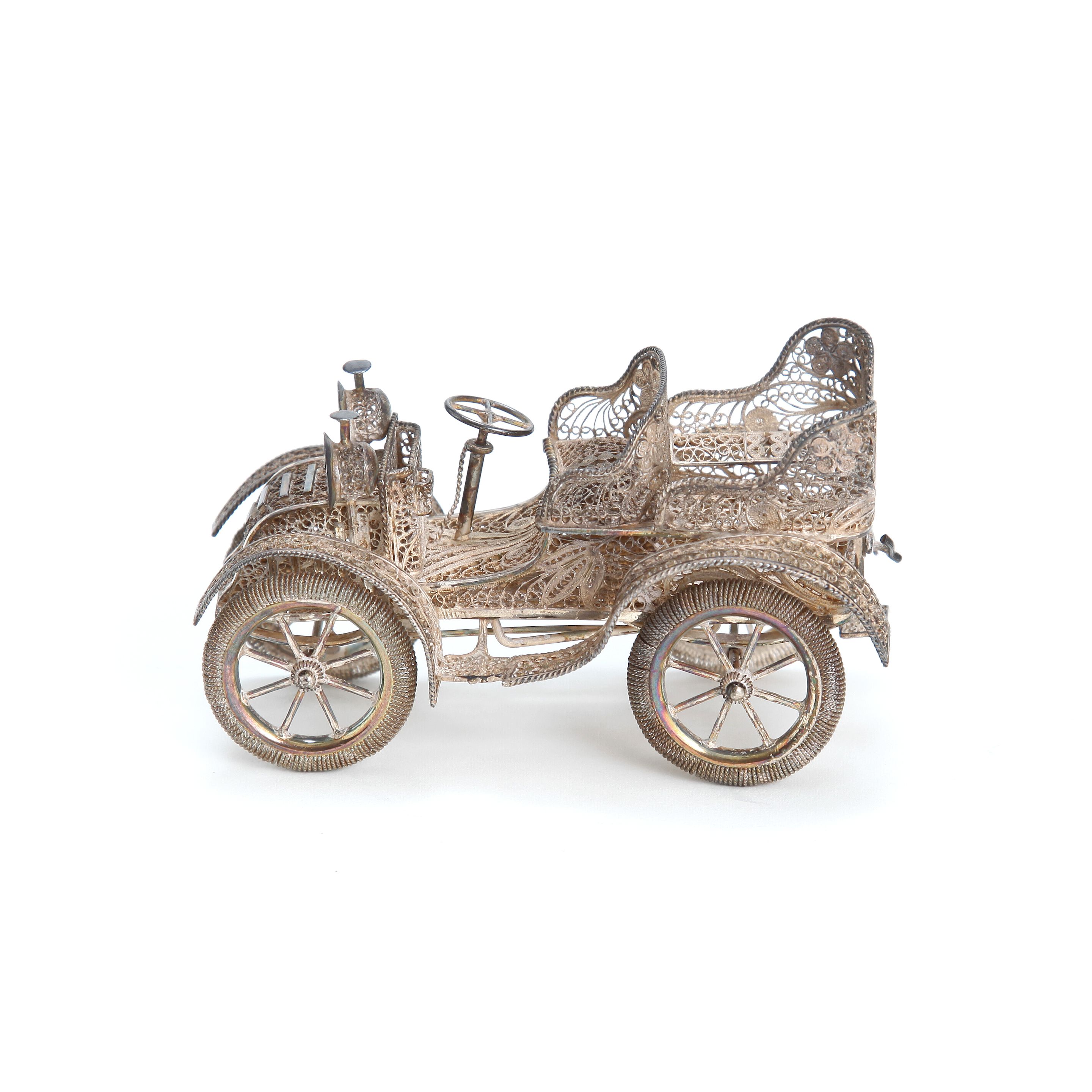 Bonhams Cars : A silver filigree model of a veteran car, probably ...