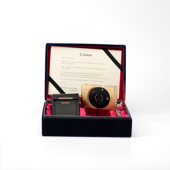 Bonhams : Canon Ixus gold plated 60th Annivesary lens