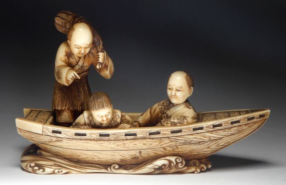 Bonhams : A Japanese ivory carvingOf three figures in a boat, one ...