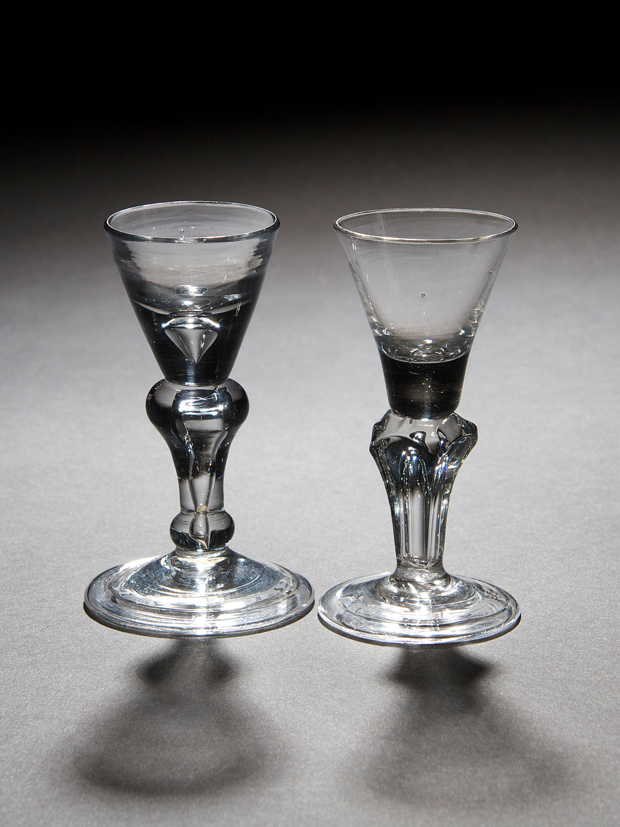 Bonhams A Small Deceptive Baluster Gin Glass And A Moulded Stem Gin Glass Circa 1715 And 1740