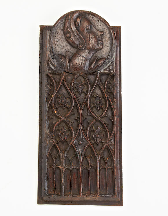 Bonhams : A late 15th century carved oak tracery panel, topped by an associated mid-16th century ...