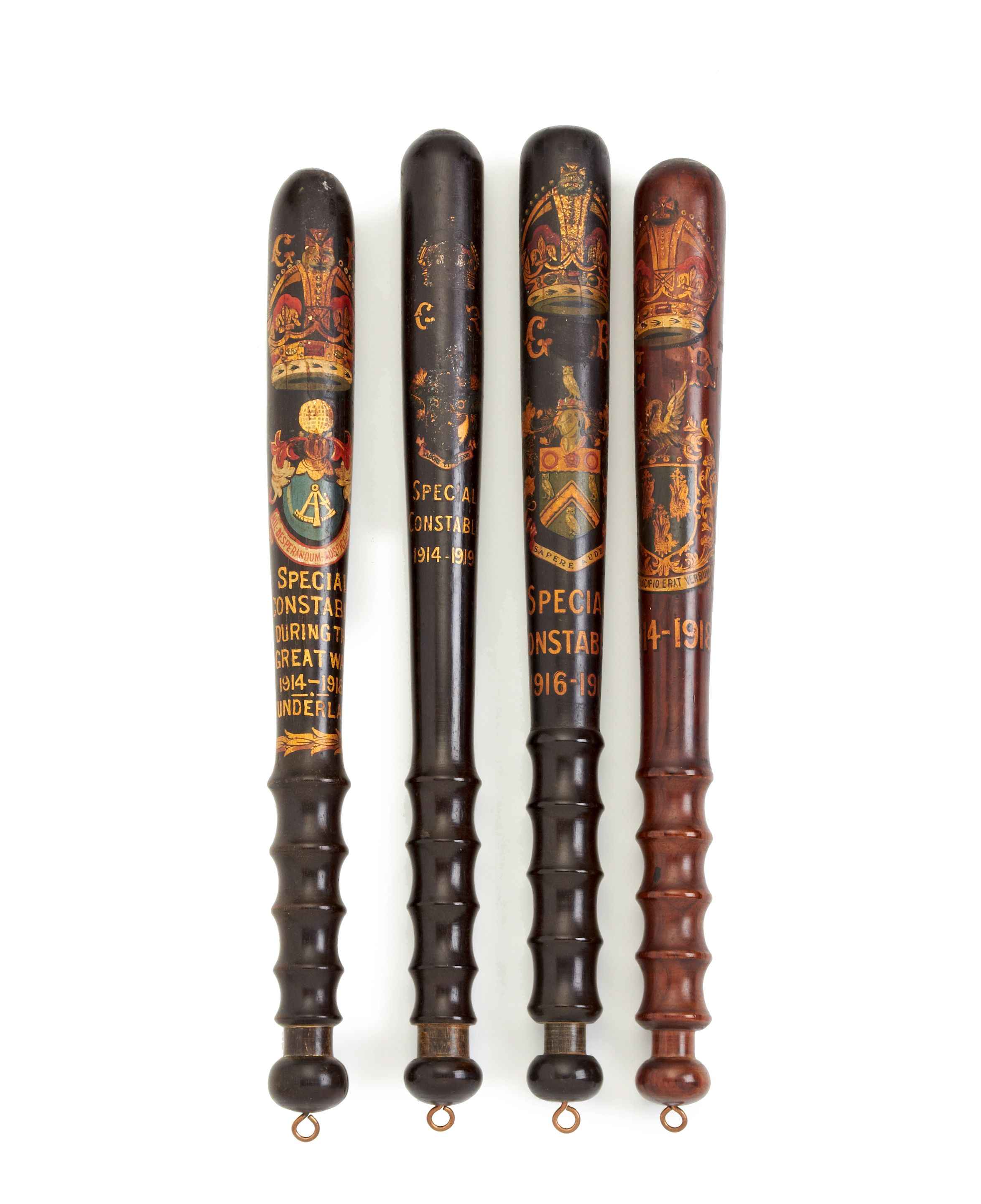 Bonhams : A group of four George V painted and gilt-highlighted truncheons
