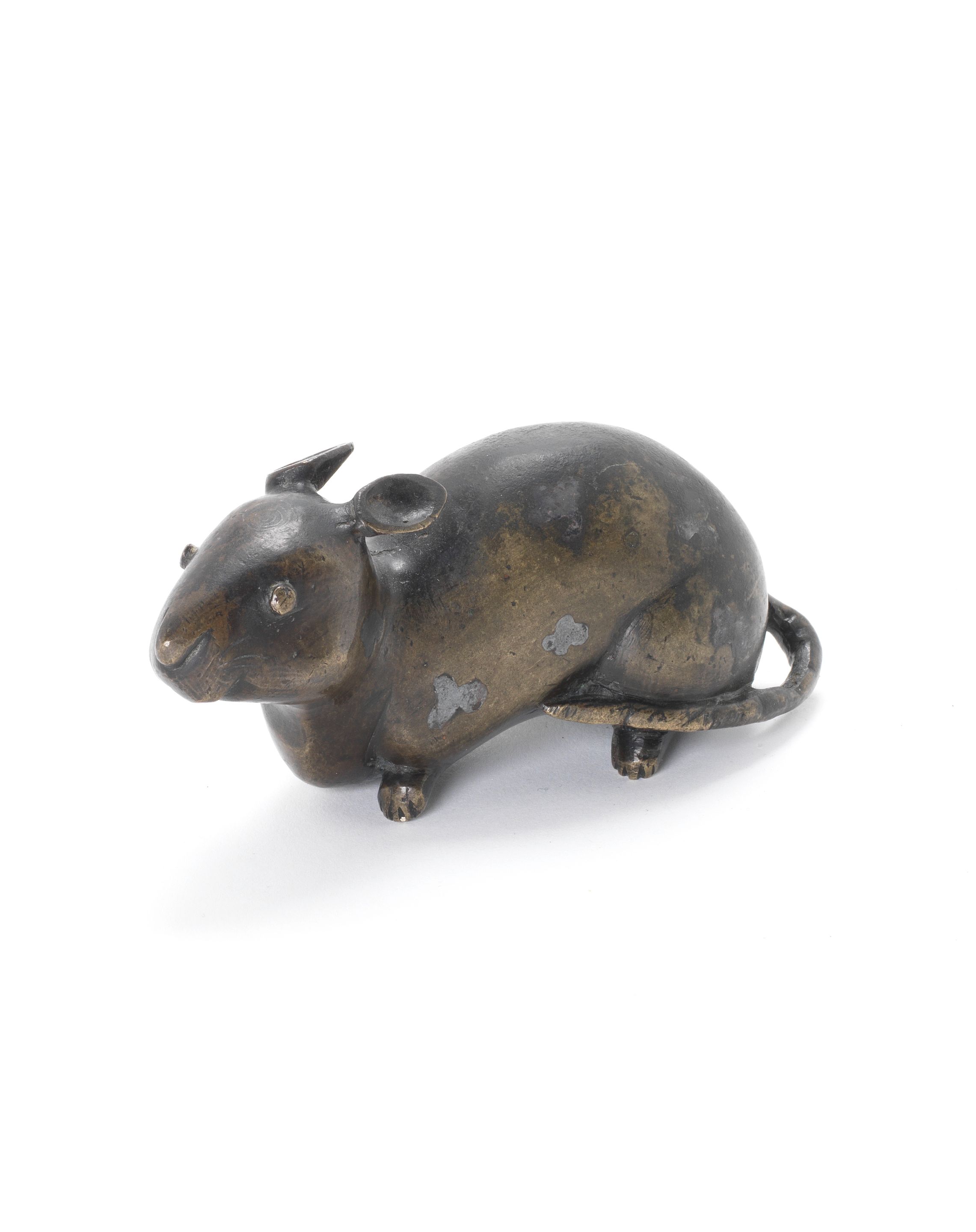 Bonhams : A silver splashed bronze scroll weight 17th/18th century