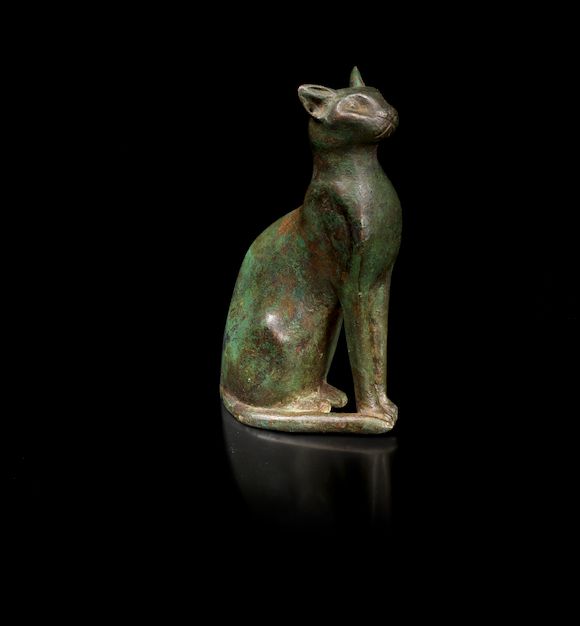Bonhams : An Egyptian bronze cat