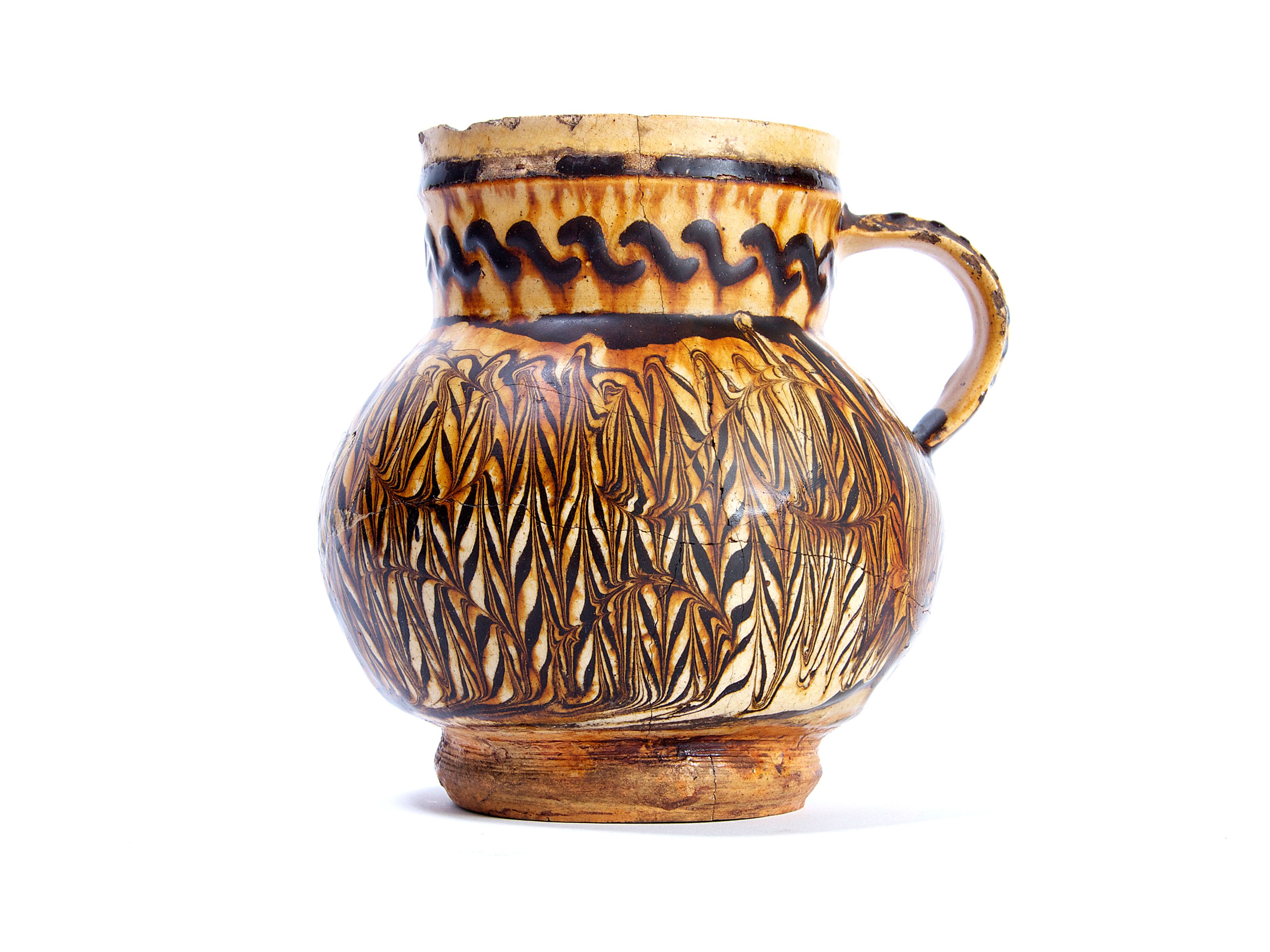 Bonhams : A rare North Staffordshire slipware mug, late 17th century