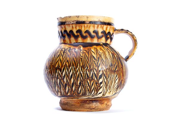 Bonhams : A rare North Staffordshire slipware mug, late 17th century
