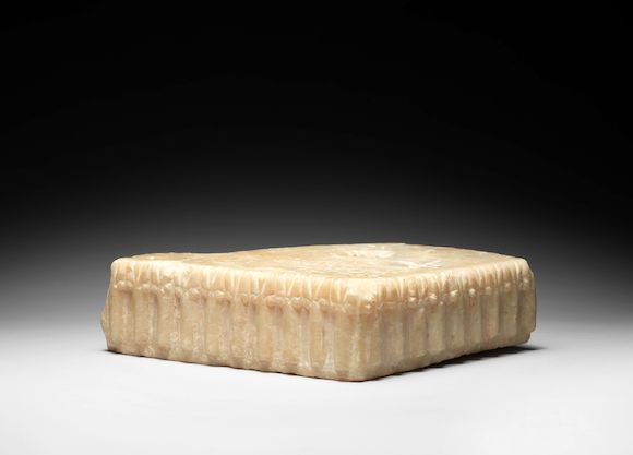 Bonhams : A South Arabian alabaster statue base fragment with ibex heads