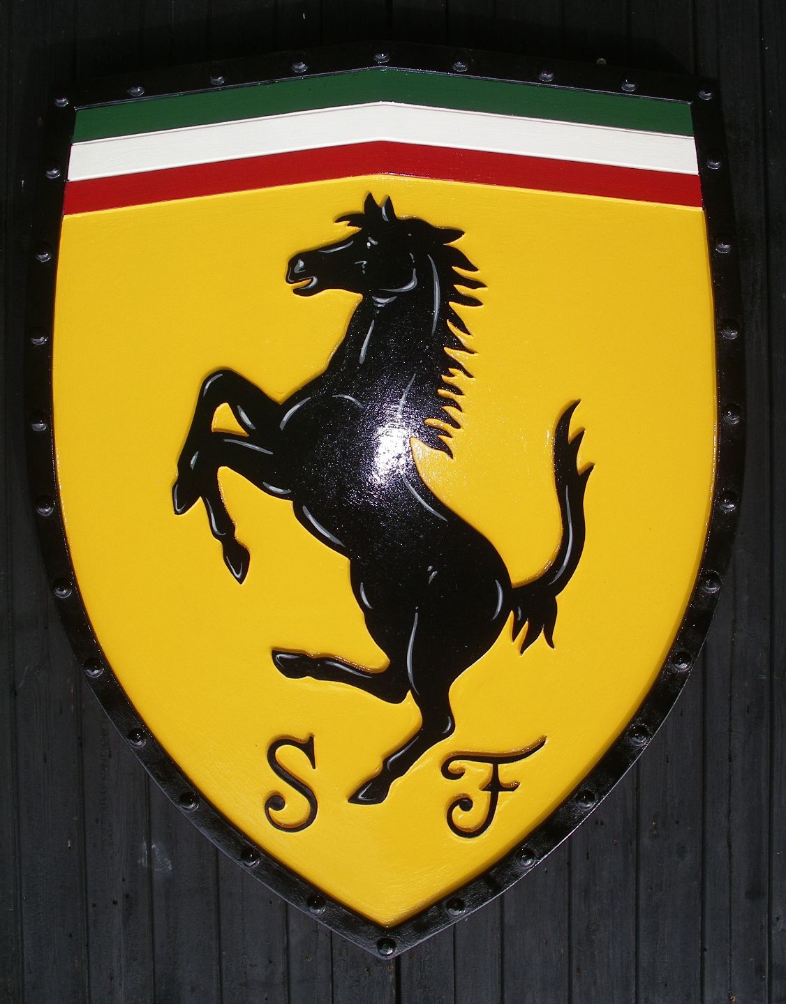 Bonhams Cars : A hand-painted Ferrari garage display shield,