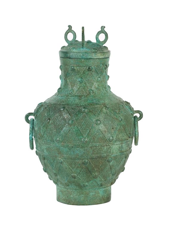 Bonhams : A bronze oviform jar and cover, early style