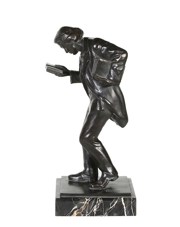 Bonhams : J. Plessner (German, B. 1871): A bronze figure of a man reading