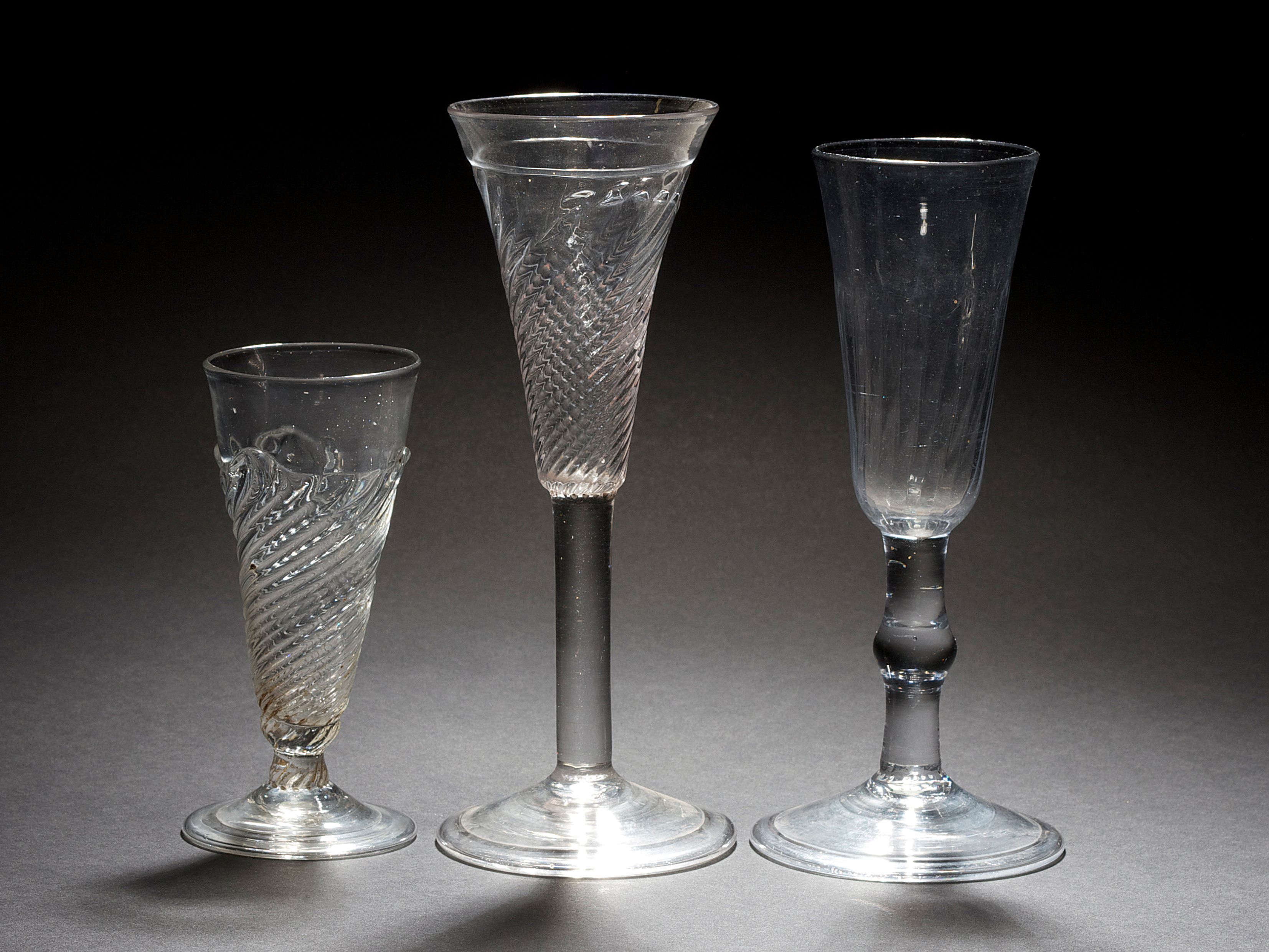 Bonhams : Two early ale flutes and a short ale glass, circa 1750