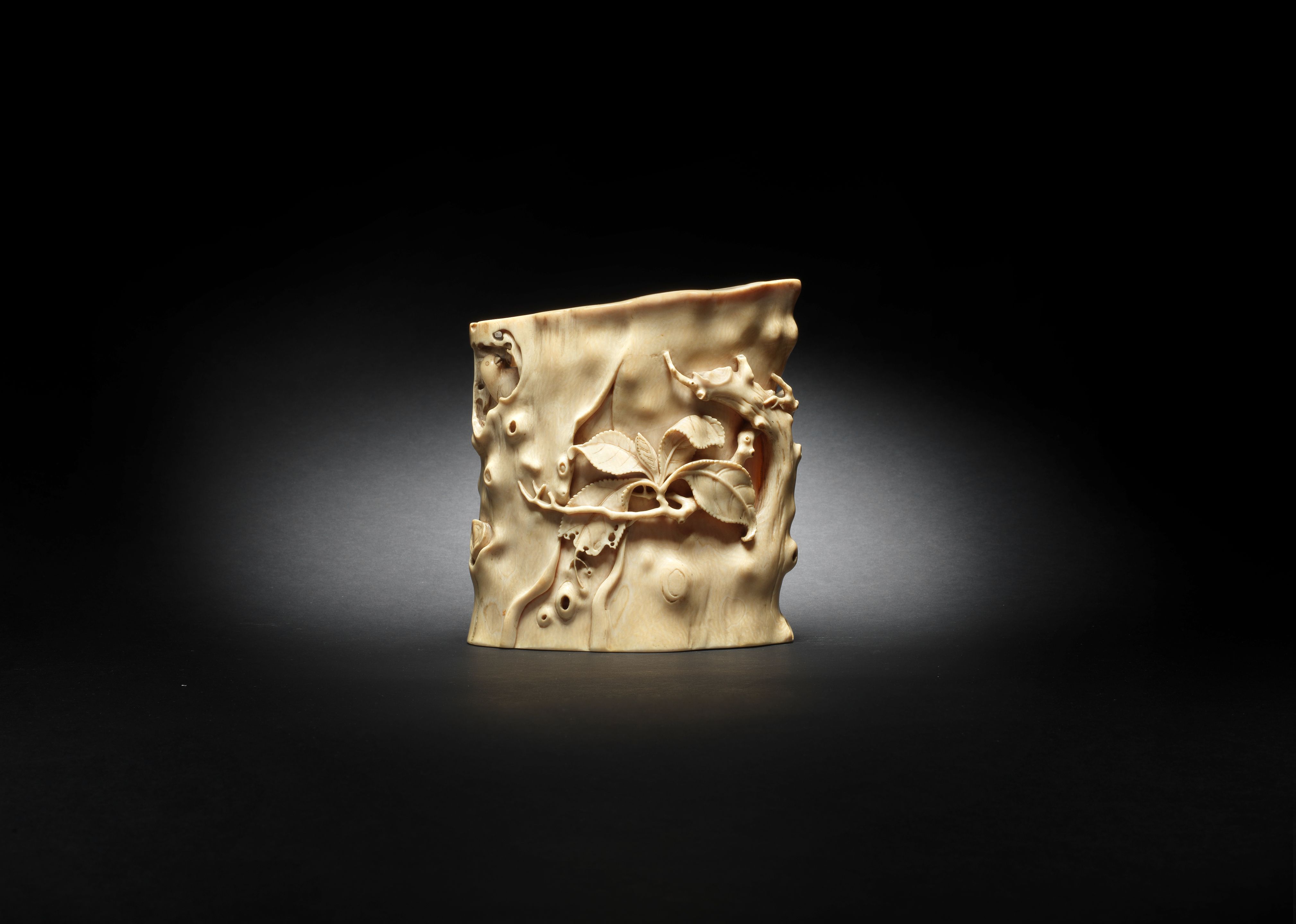 Bonhams : A superb carved ivory 'tree trunk' brush pot, bitong 18th century