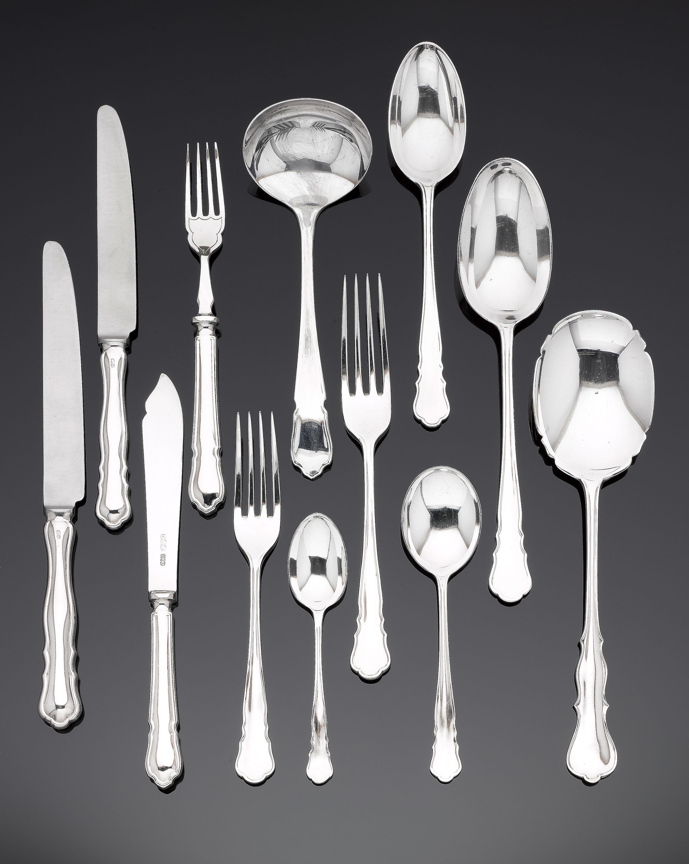 Bonhams : A silver Chippendale pattern table service of flatware and ...