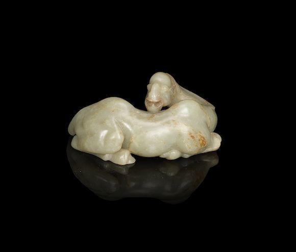 Bonhams : A large pale green and russet jade carving of a Bactrian ...