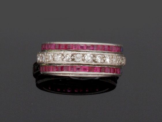 Bonhams : A diamond, ruby and sapphire swivel hoop eternity ring