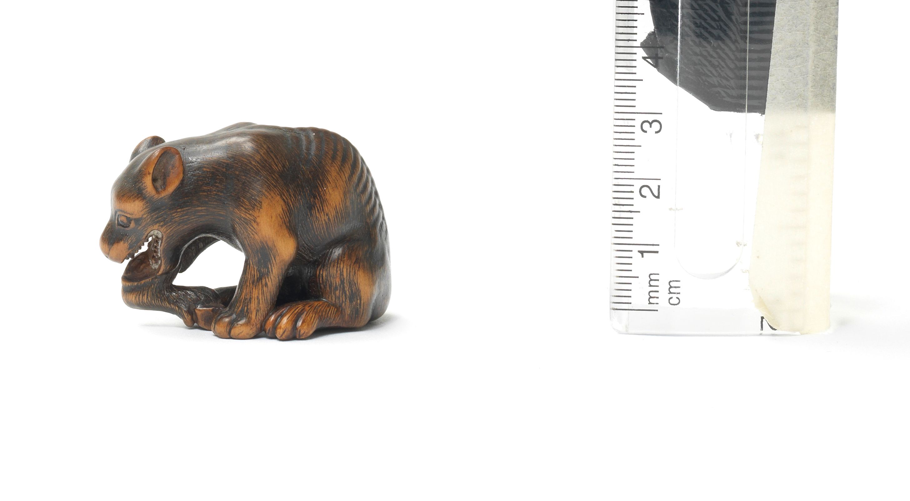 Bonhams : A wood netsuke of a wolf By Masanao, Ise, early 19th century