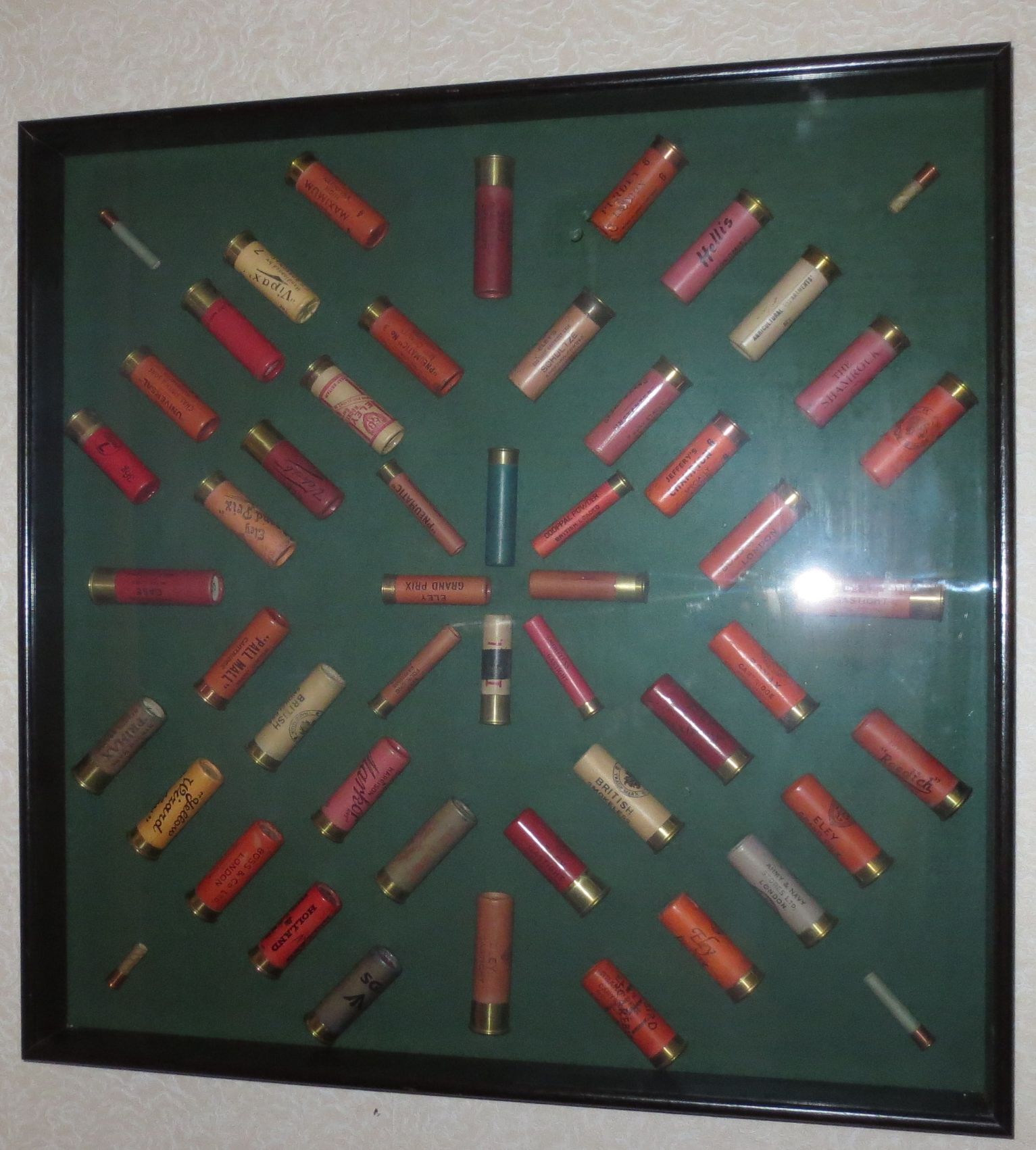 Bonhams Cars : A good framed display of shotgun shells,