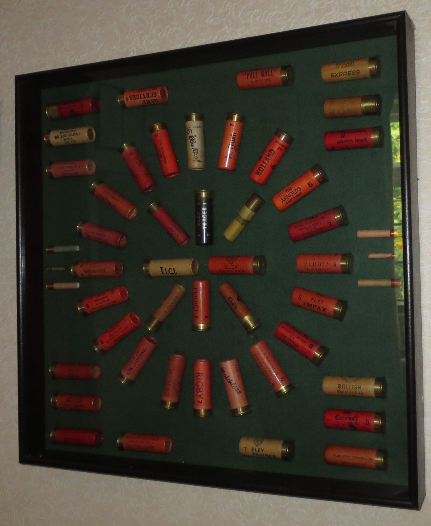 Bonhams Cars : A good framed display of shotgun shells,