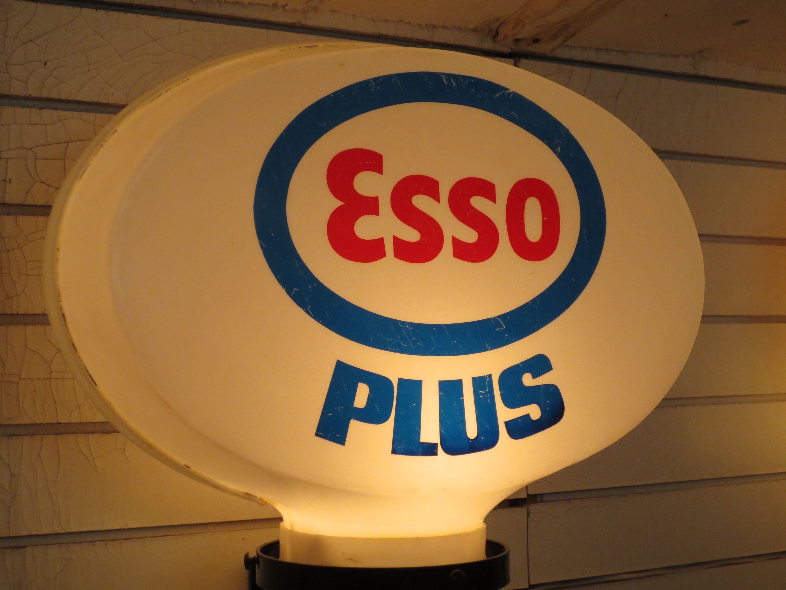 Bonhams Cars : An Esso Plus petrol pump globe, plastic,
