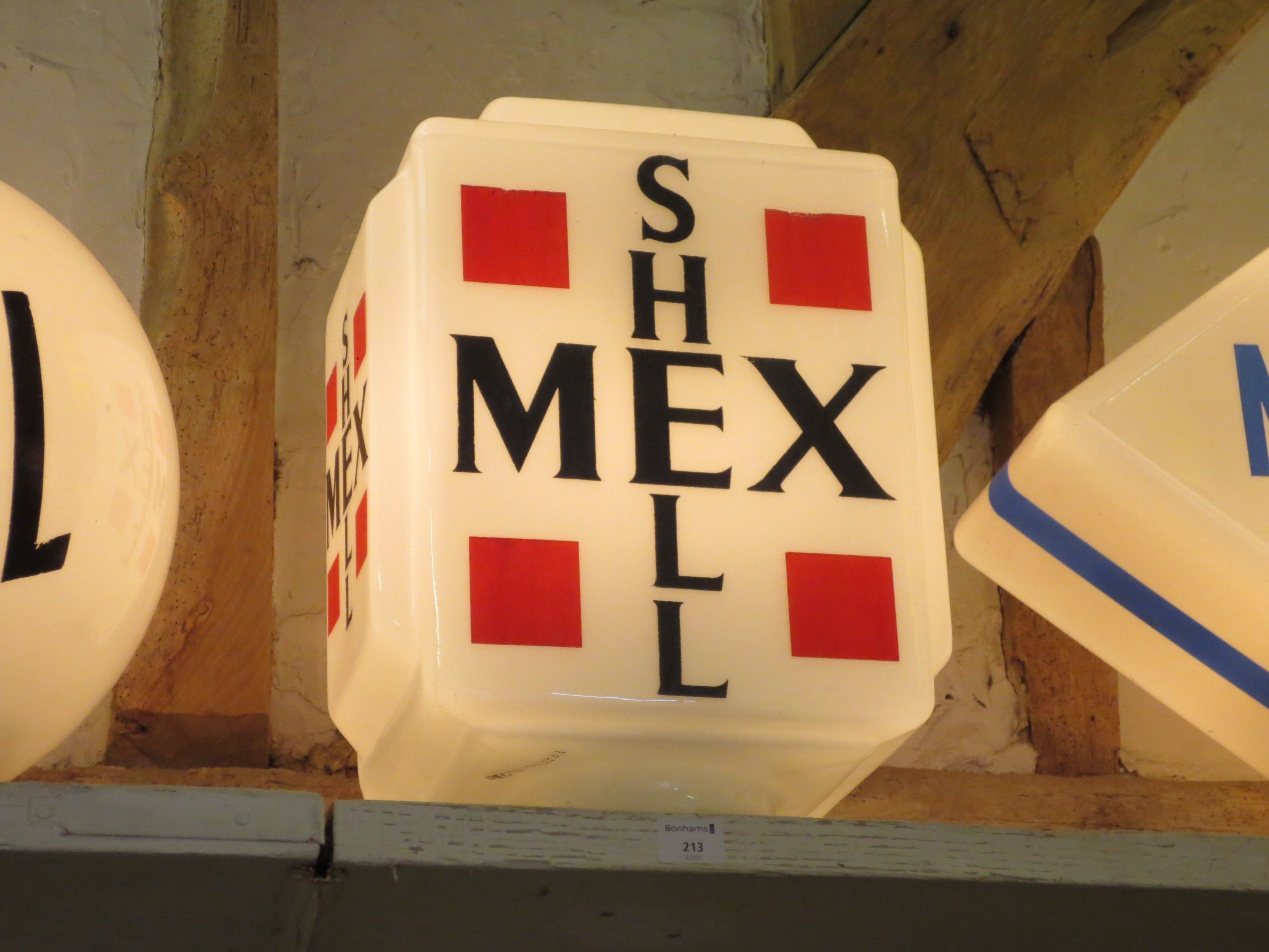 Bonhams Cars : A Shell Mex glass petrol pump globe,