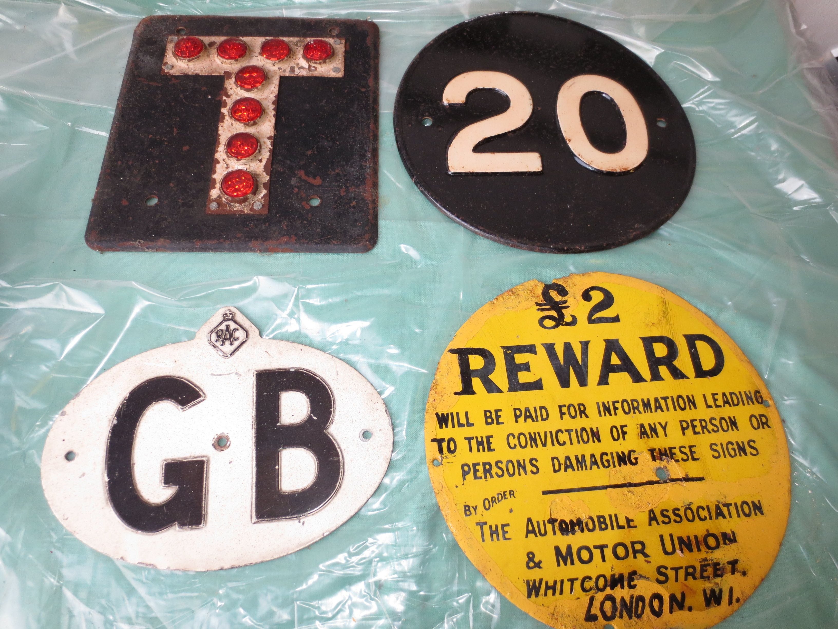 Bonhams Cars : Four small signs,