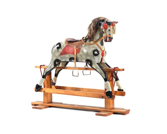 Bonhams : J. Collinson & Sons carved and painted wooden rocking horse