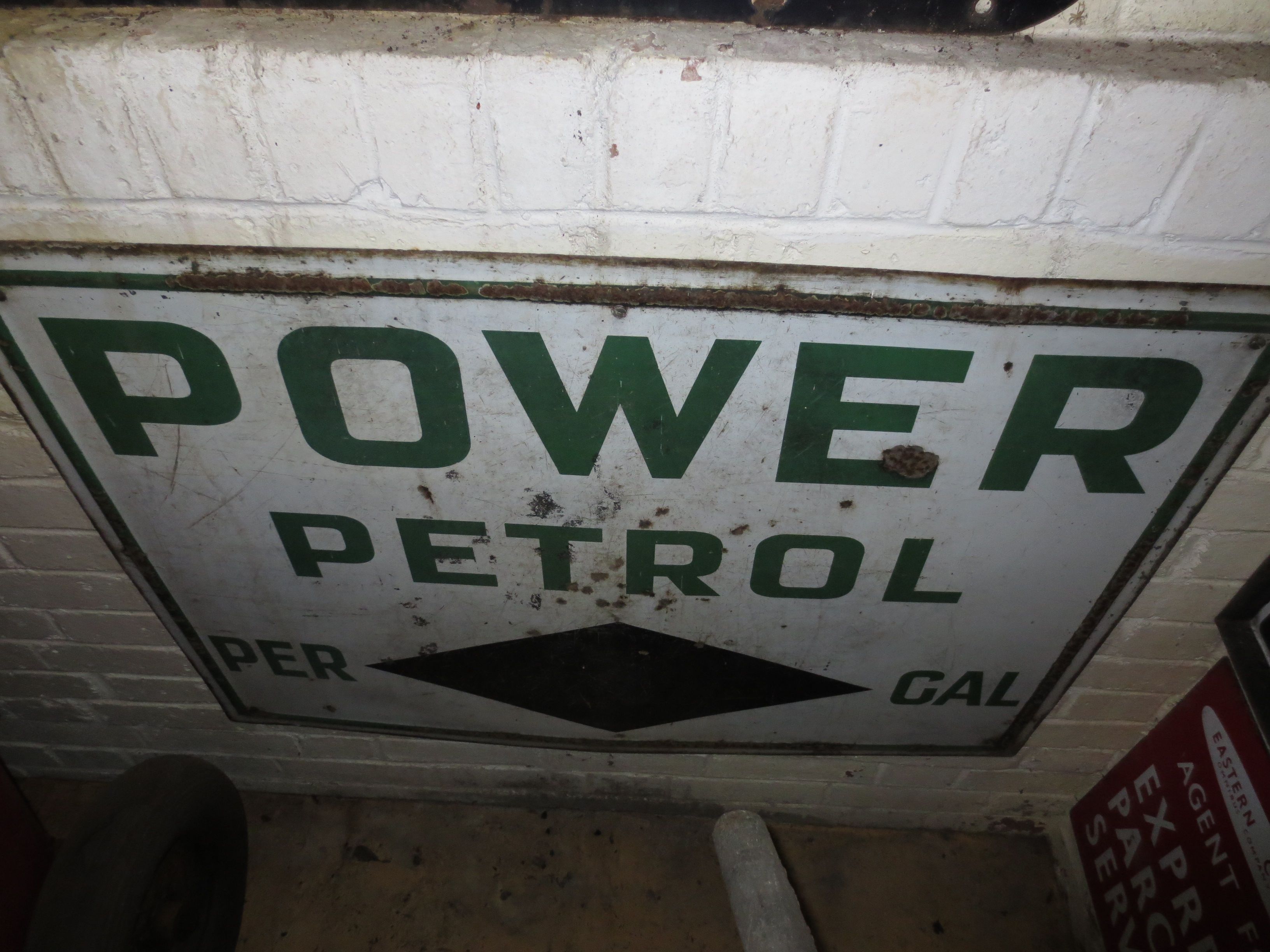 Bonhams Cars : A Power Petrol enamel sign,