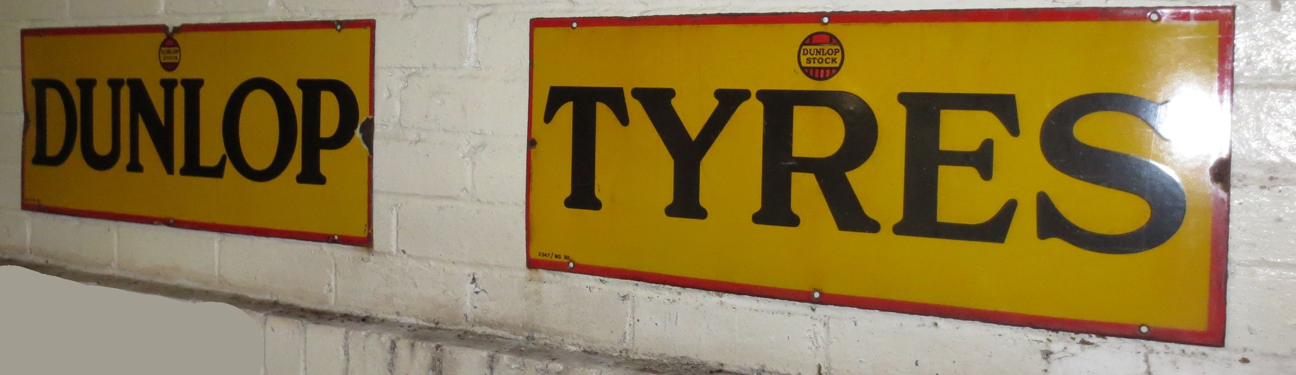 Bonhams Cars : A Dunlop Tyres two-part enamel sign,