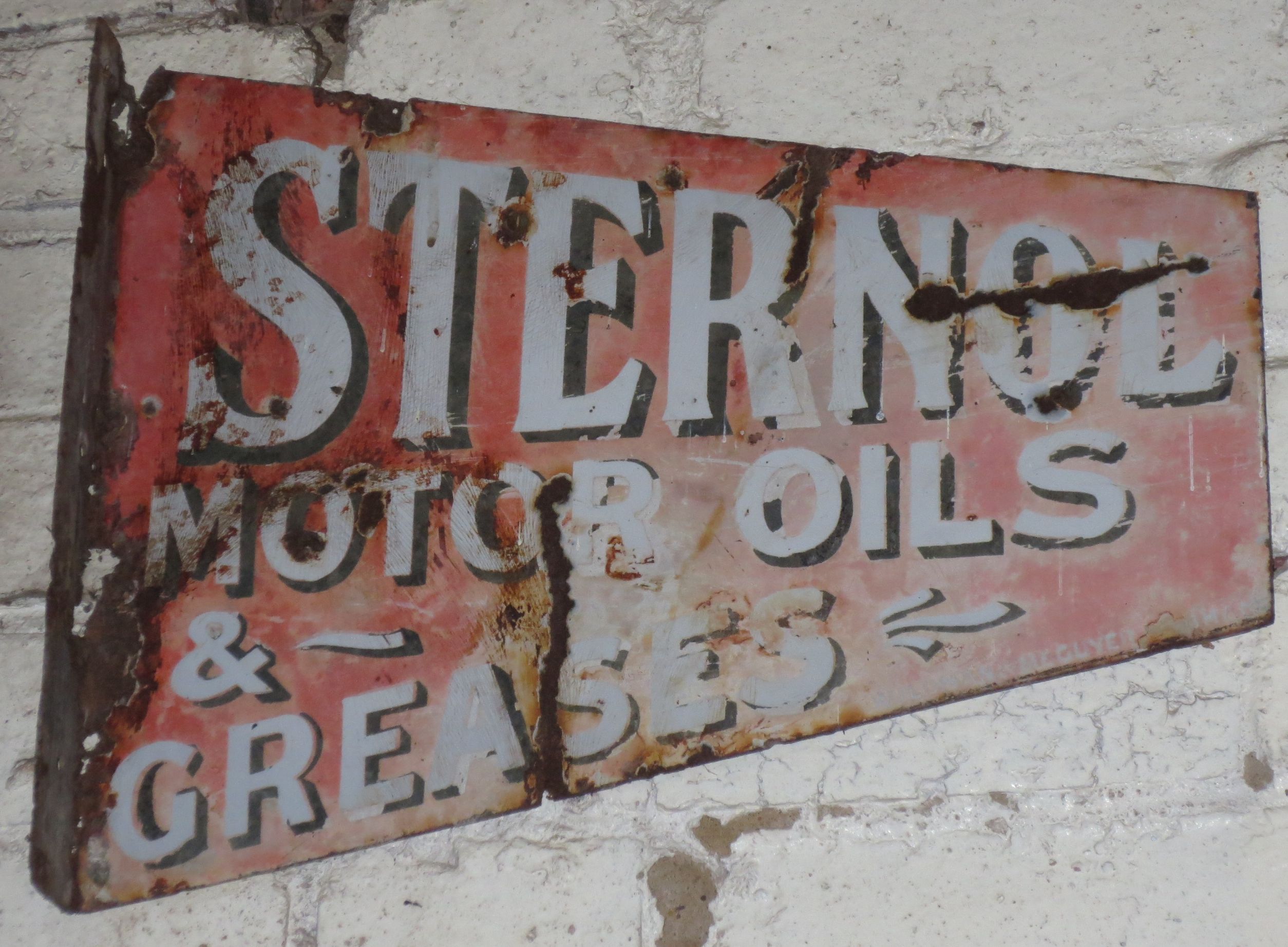 Bonhams Cars : A rare Sternol Motor Oils & Greases enamel pennant sign,