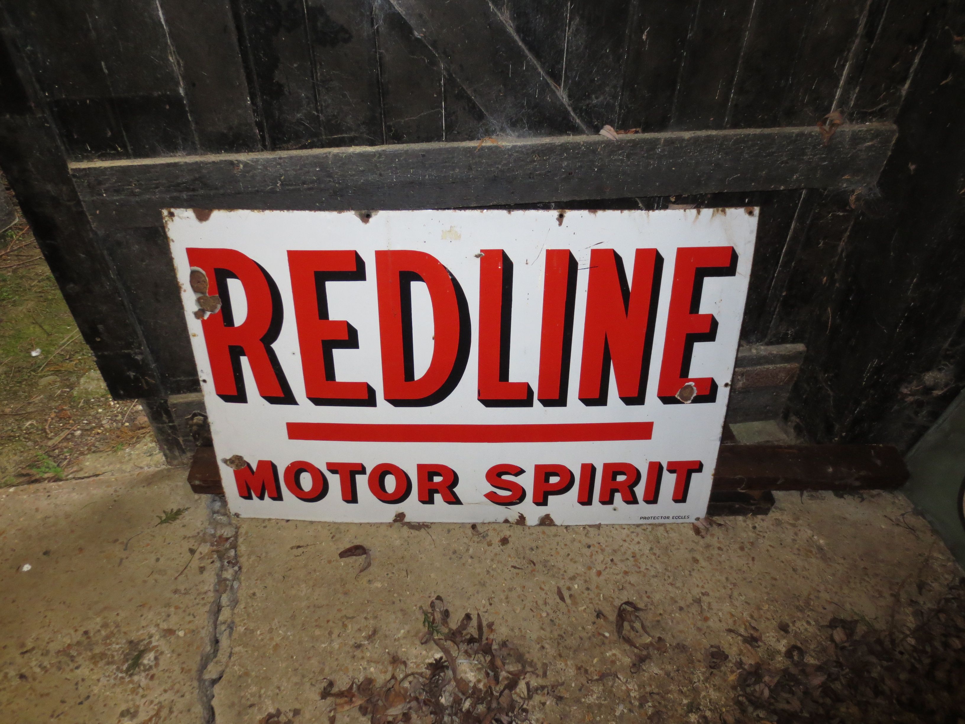 Bonhams Cars : A Redline Motor Spirit enamel sign,