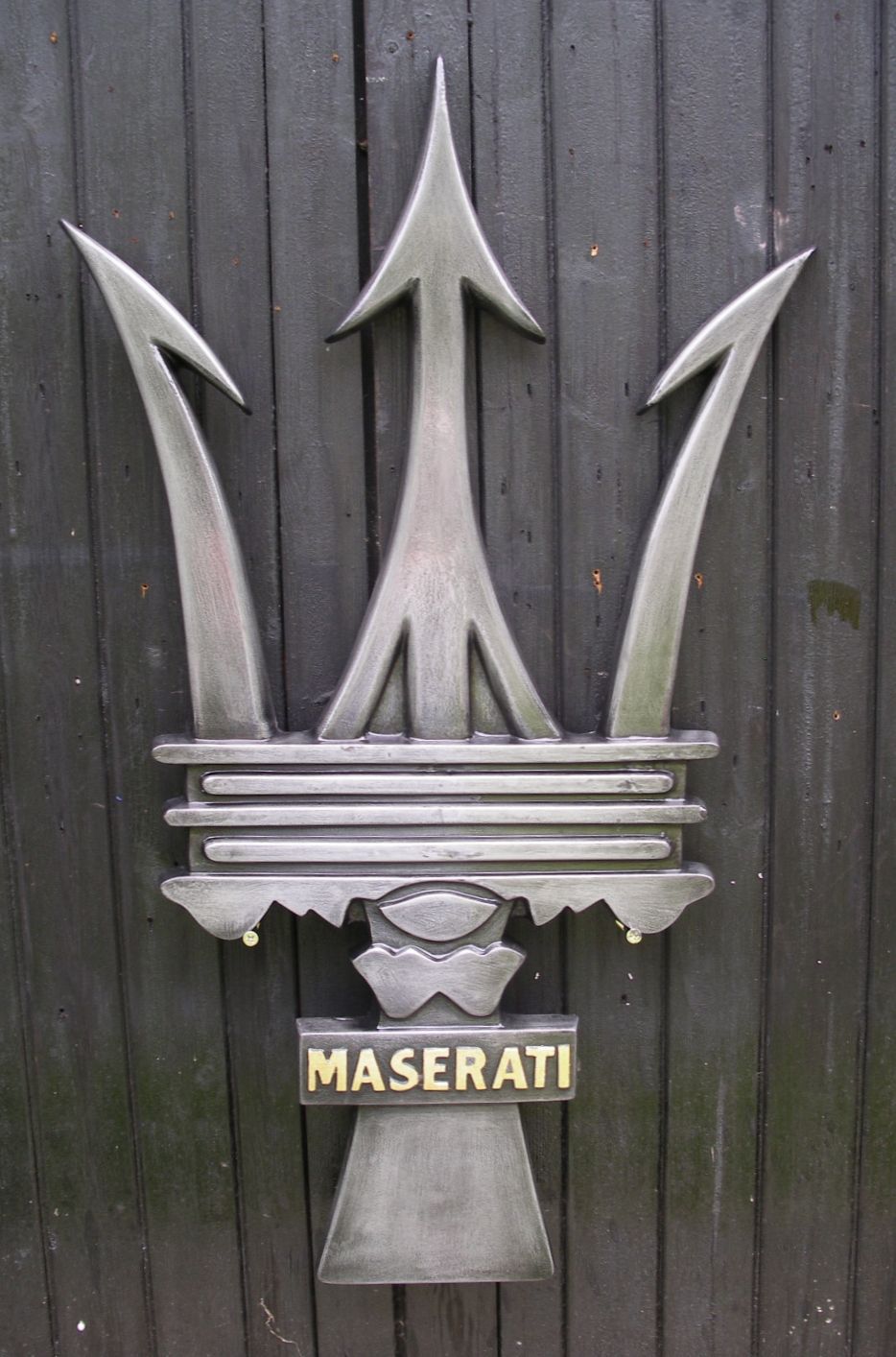 Bonhams Cars : A Maserati Trident garage display emblem,