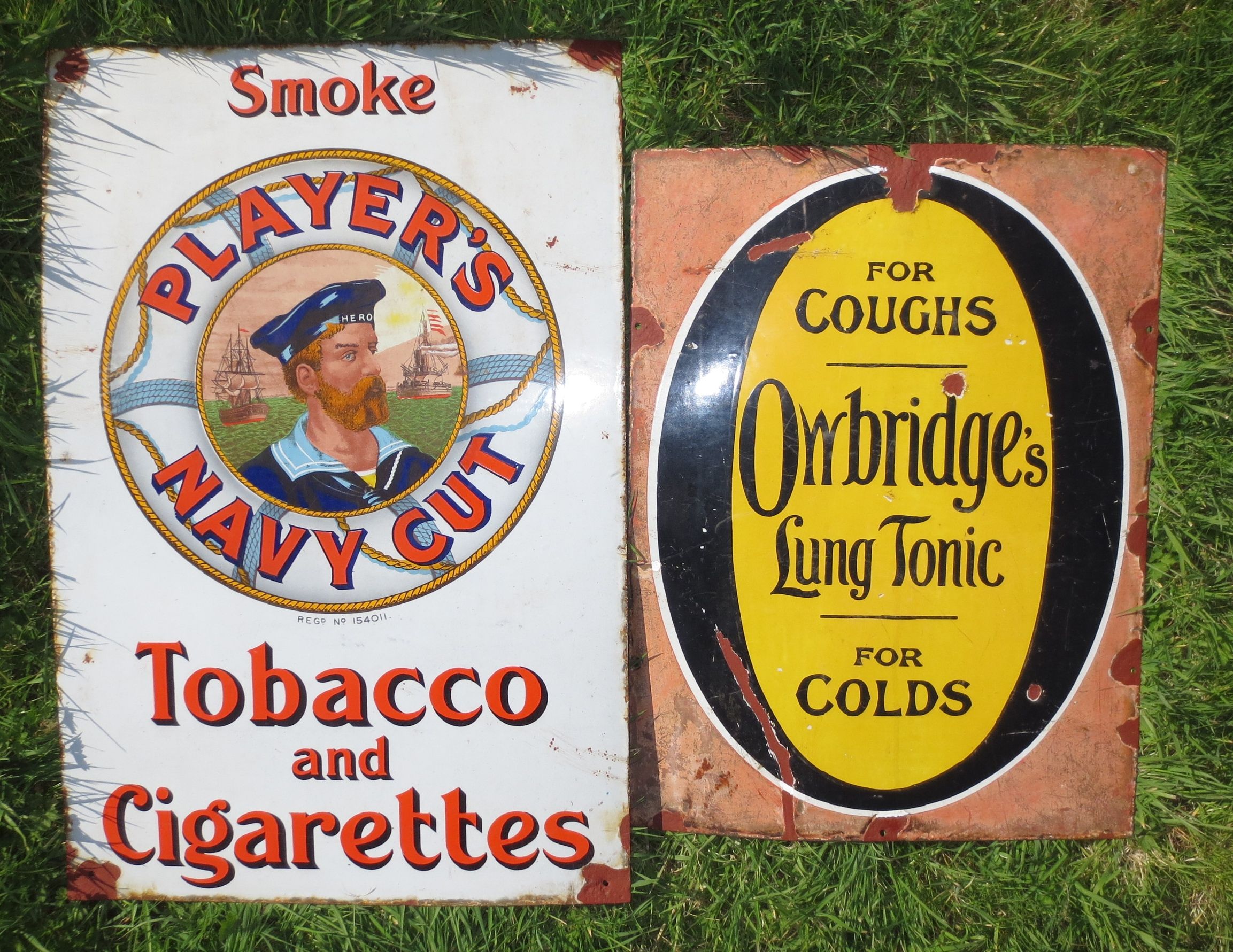 Bonhams Cars : Two enamel advertising signs,