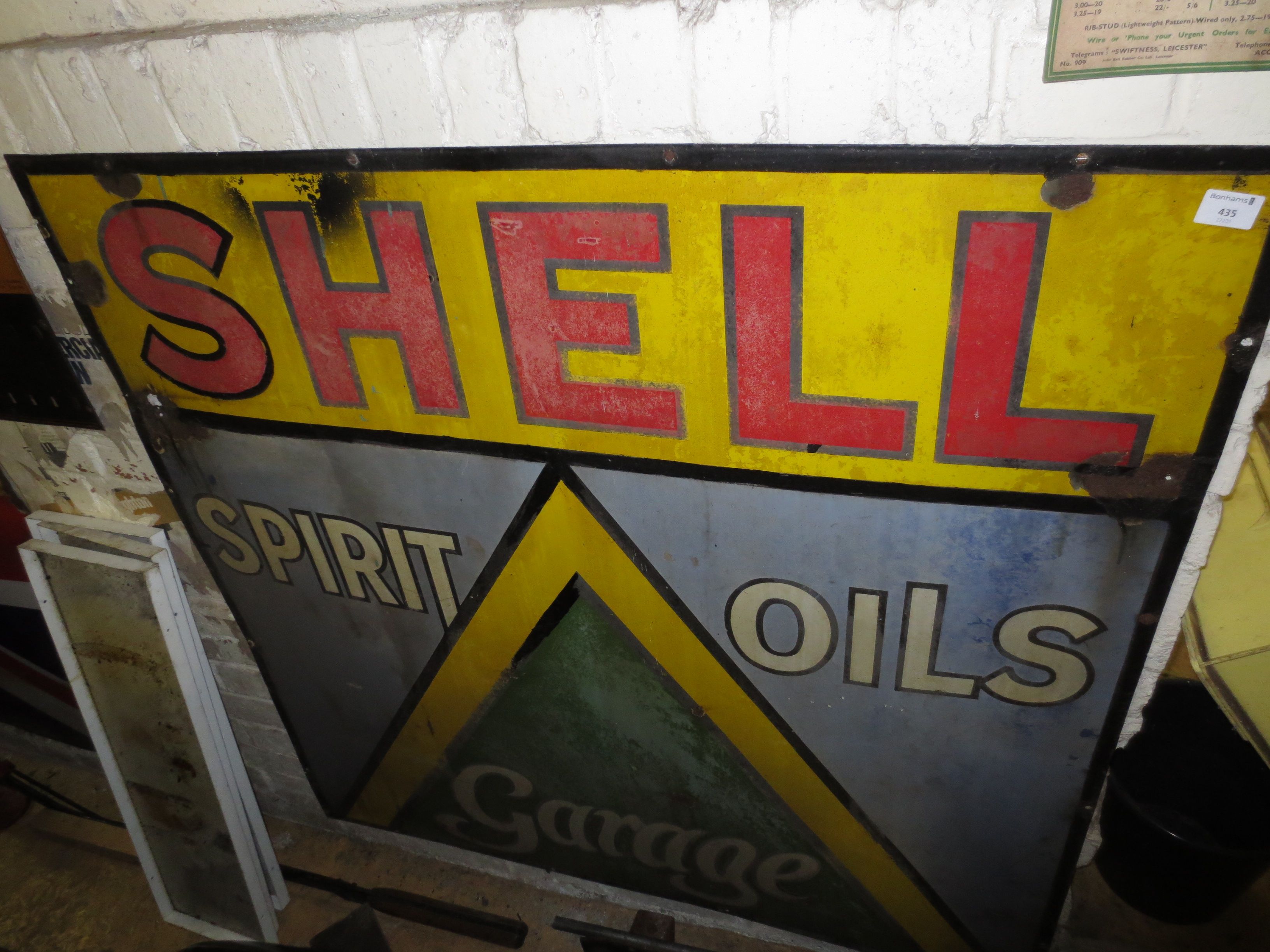 Bonhams Cars : A large Shell Spirit Oils Garage enamel sign,